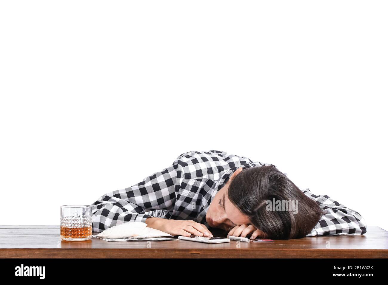 Female junkie with drugs and alcohol at table on white background Stock ...