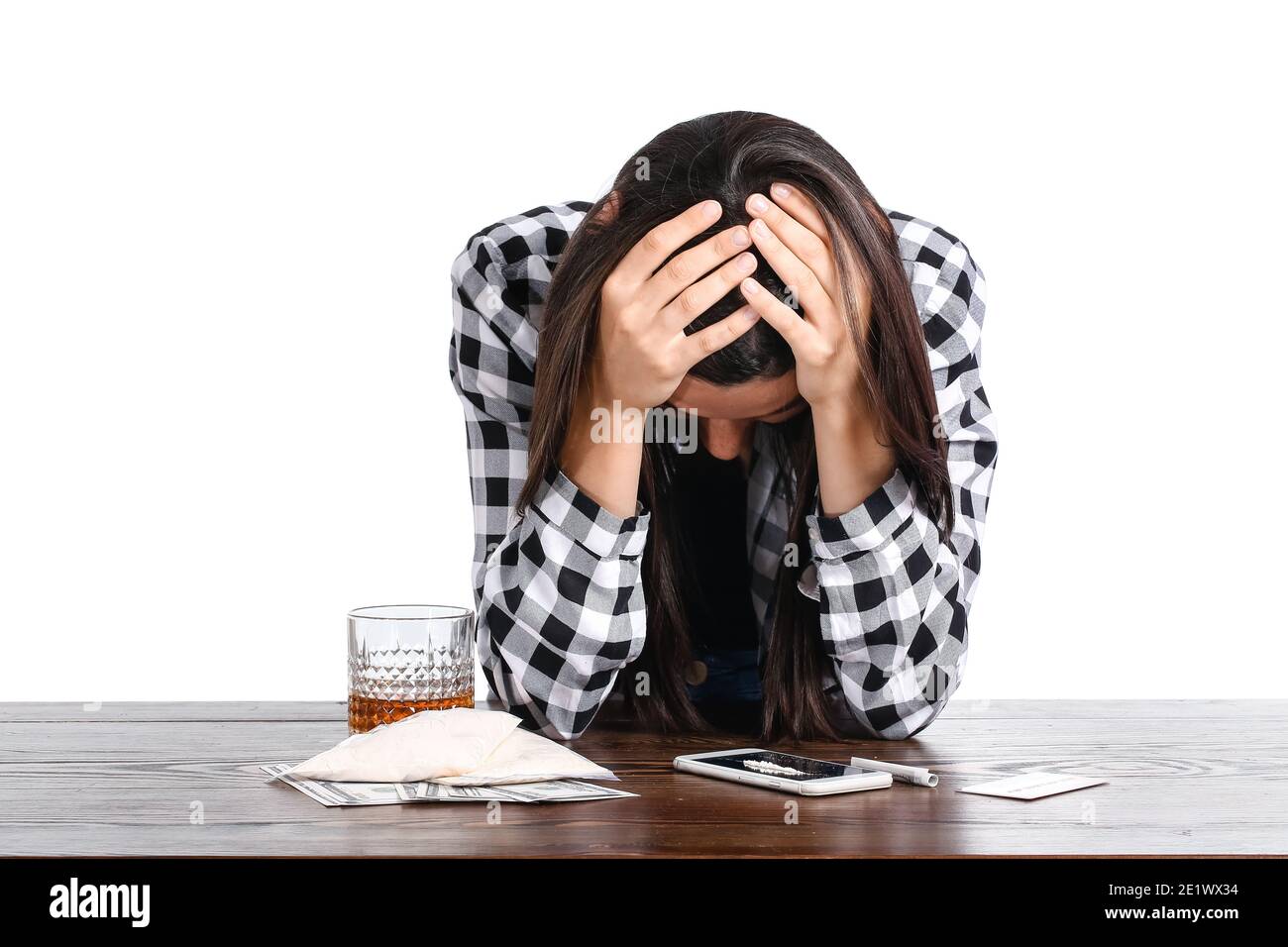 Female junkie with drugs and alcohol at table on white background Stock ...