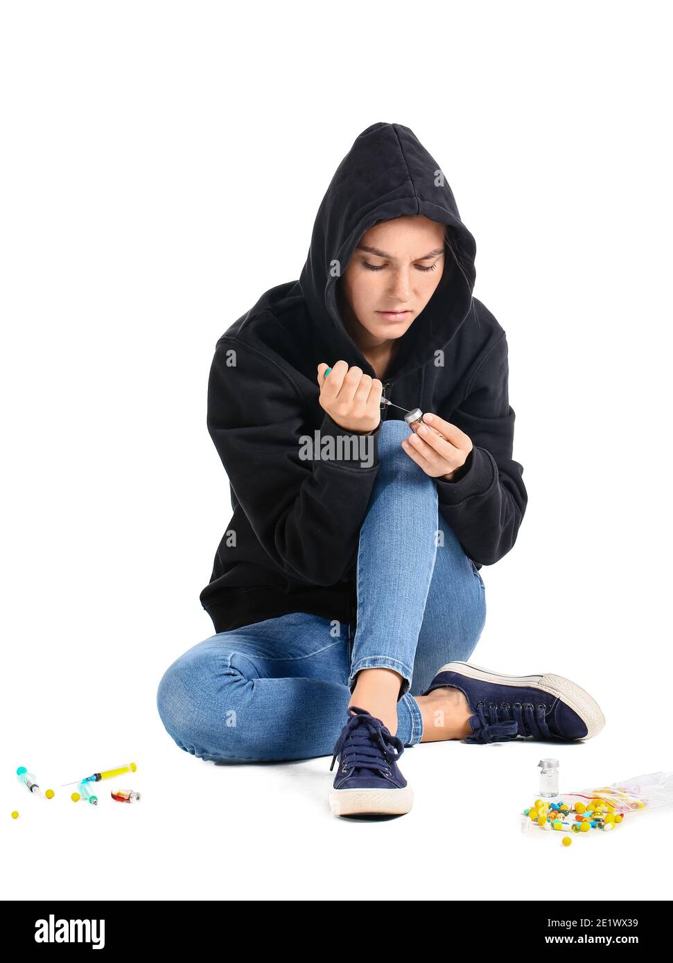 Female junkie with drugs on white background Stock Photo - Alamy