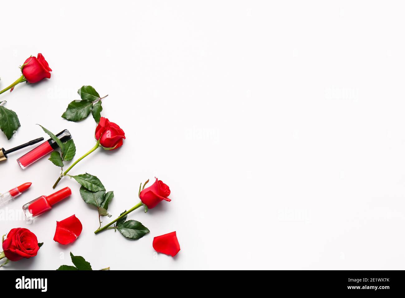 Beautiful red roses and cosmetics on white background Stock Photo - Alamy
