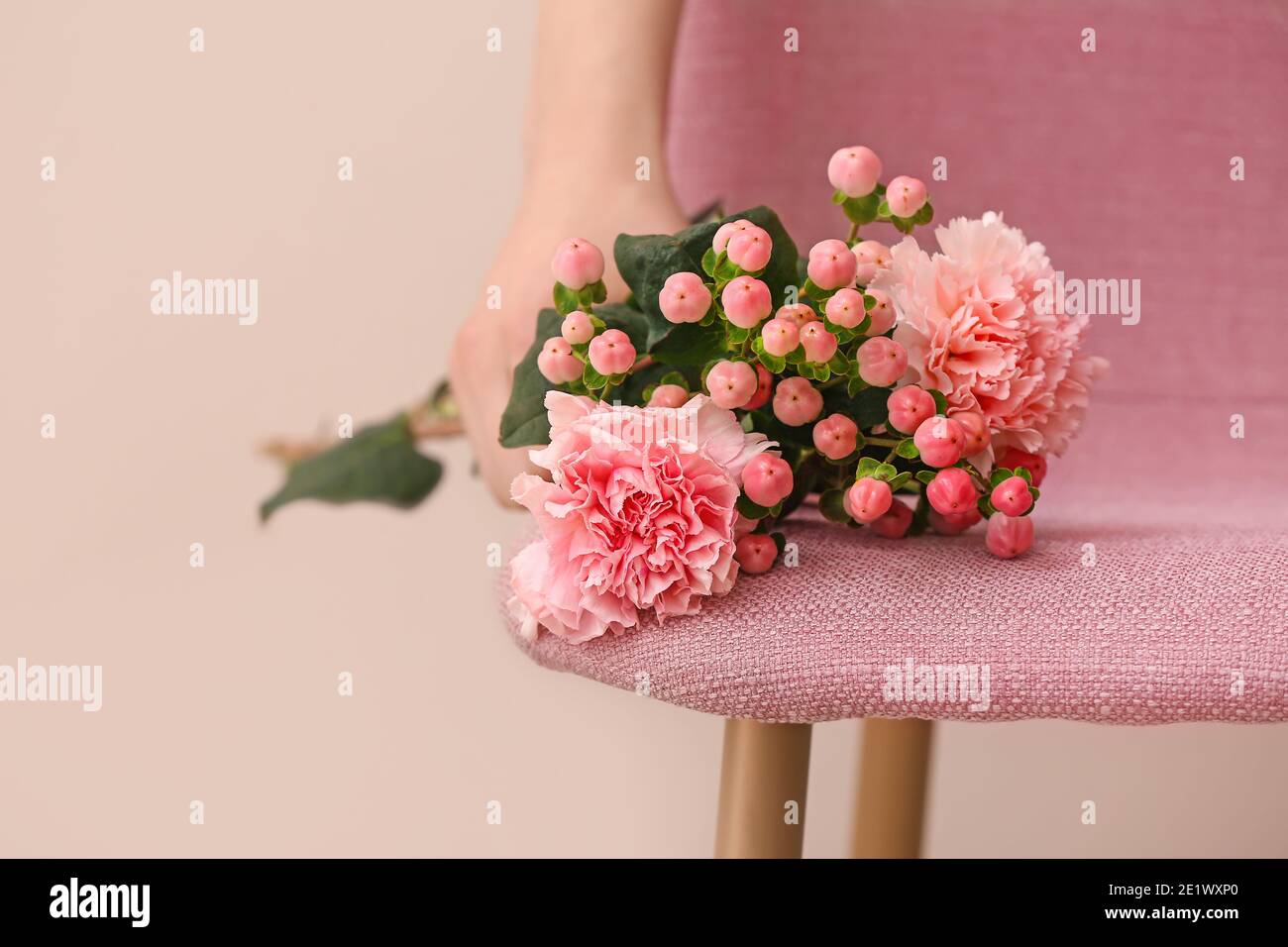Woman putting beautiful flowers hi-res stock photography and images - Alamy