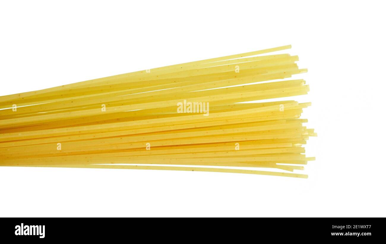 Spaghetti - yellow pasta, ready for cooking. isolated on the white ...