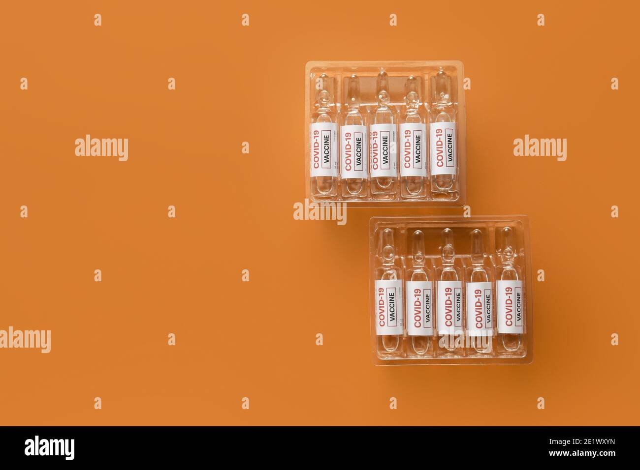 Vaccine for immunization against COVID-19 on color background Stock ...