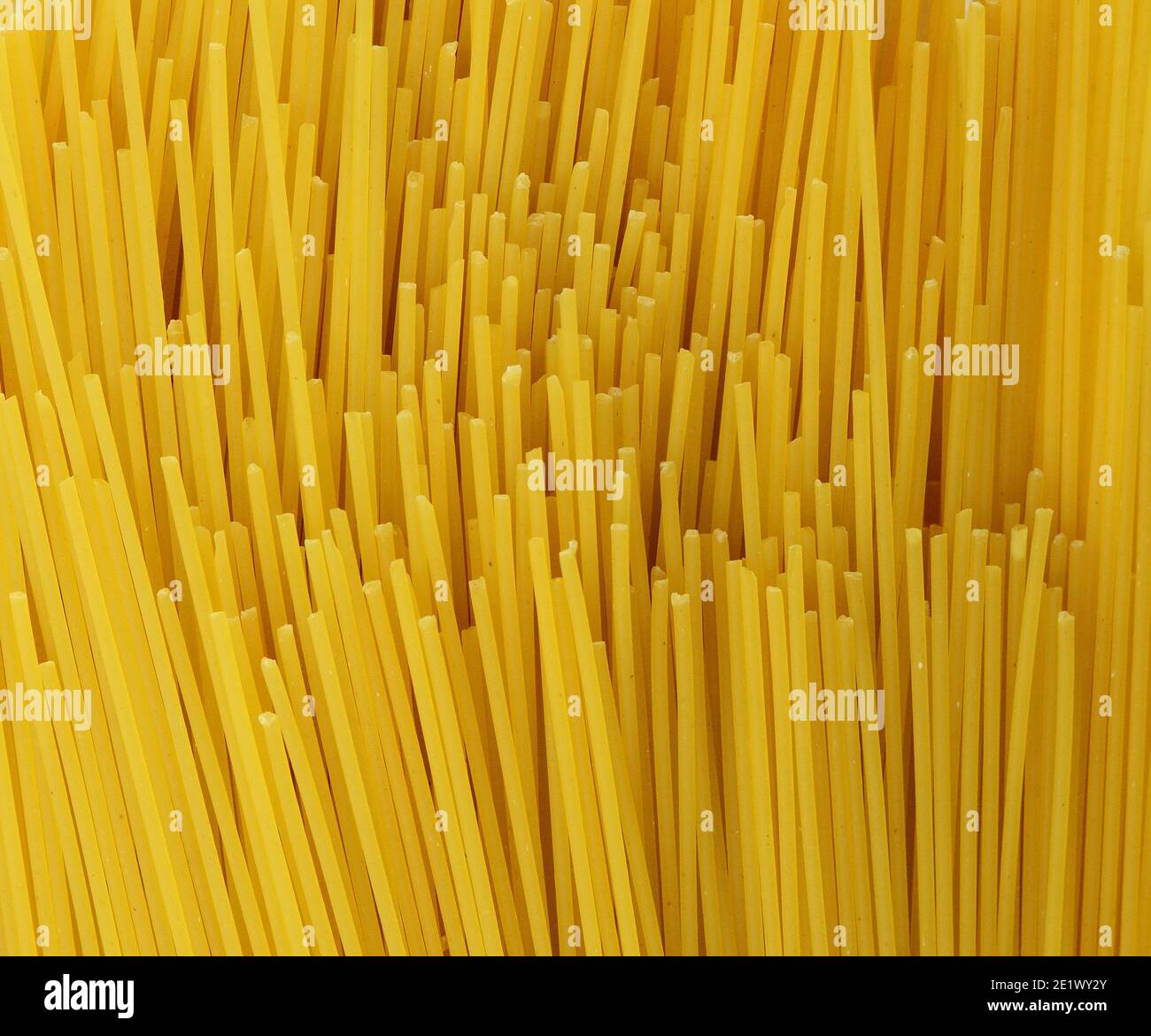 Spaghetti - yellow pasta, ready for cooking. isolated on the white ...