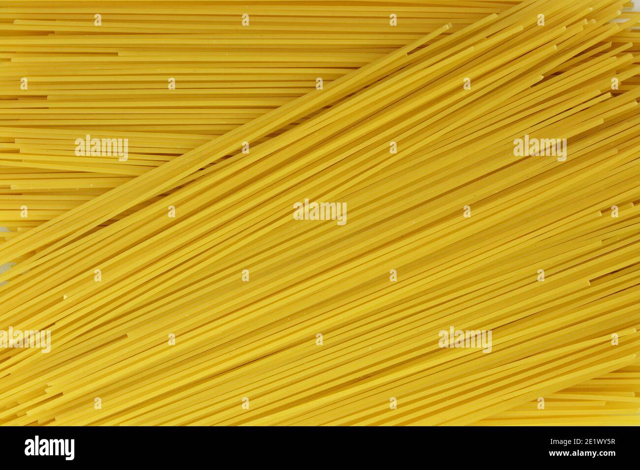 Spaghetti - yellow pasta, ready for cooking. isolated on the white ...