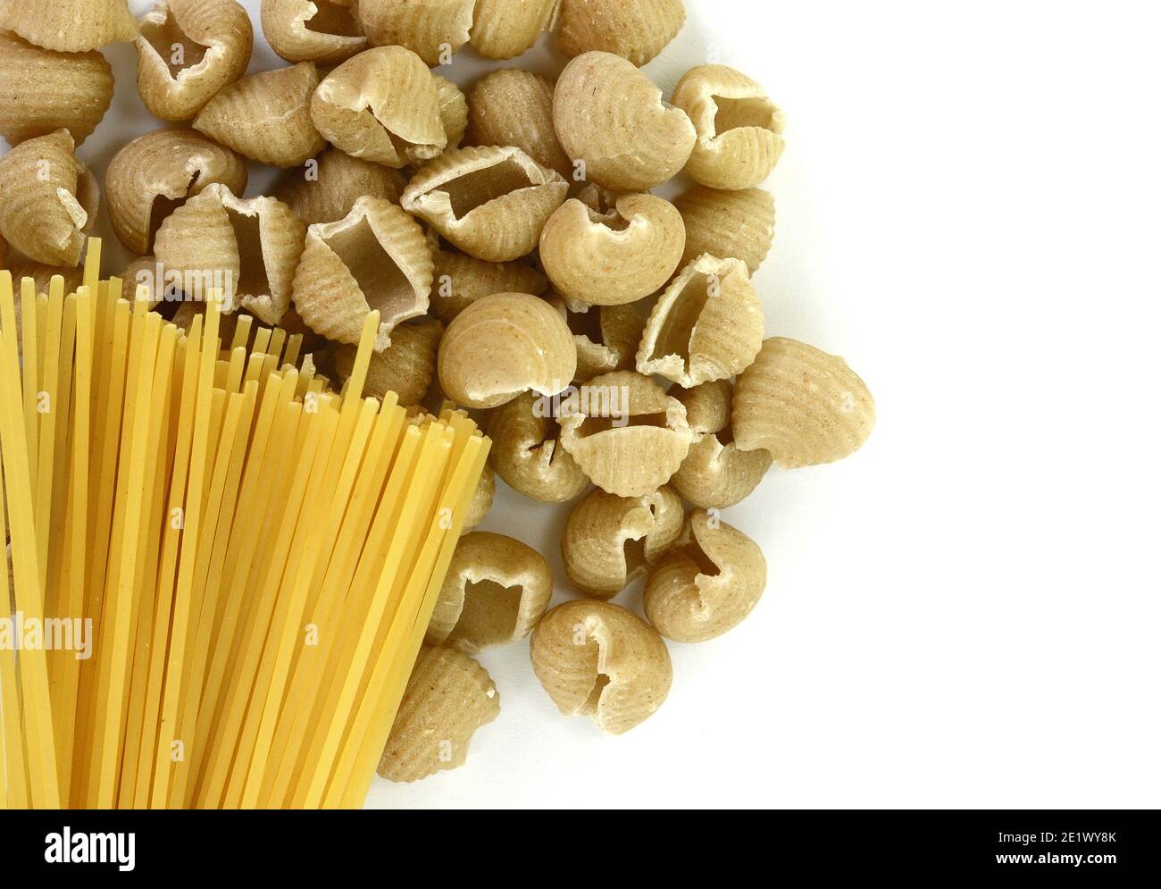 Spaghetti - yellow pasta, ready for cooking. isolated on the white ...