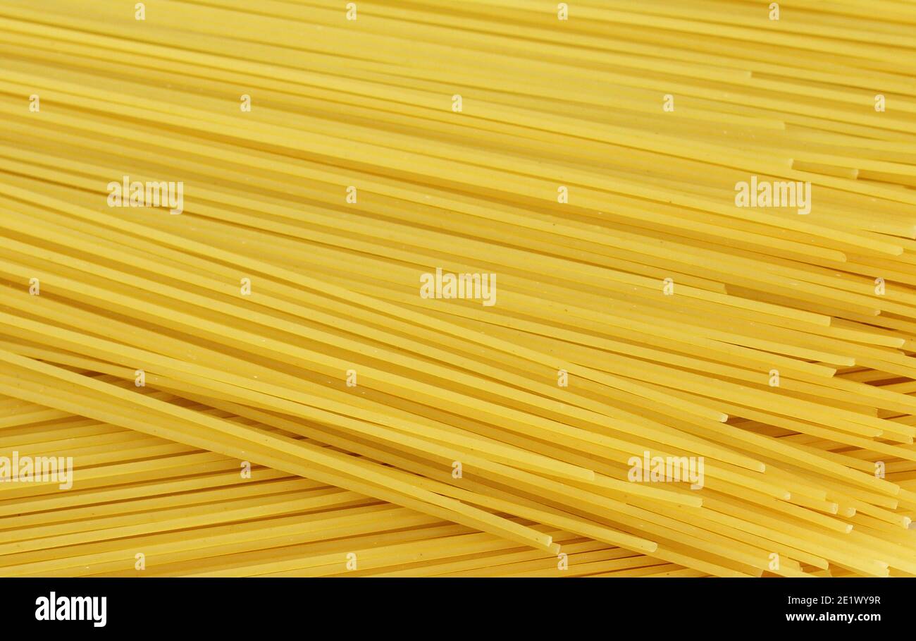 Spaghetti - yellow pasta, ready for cooking. isolated on the white ...