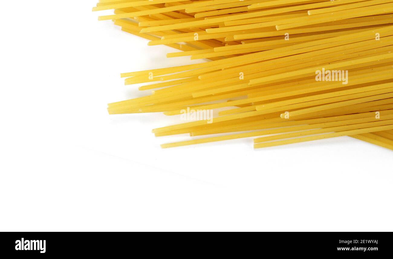 Spaghetti - yellow pasta, ready for cooking. isolated on the white ...