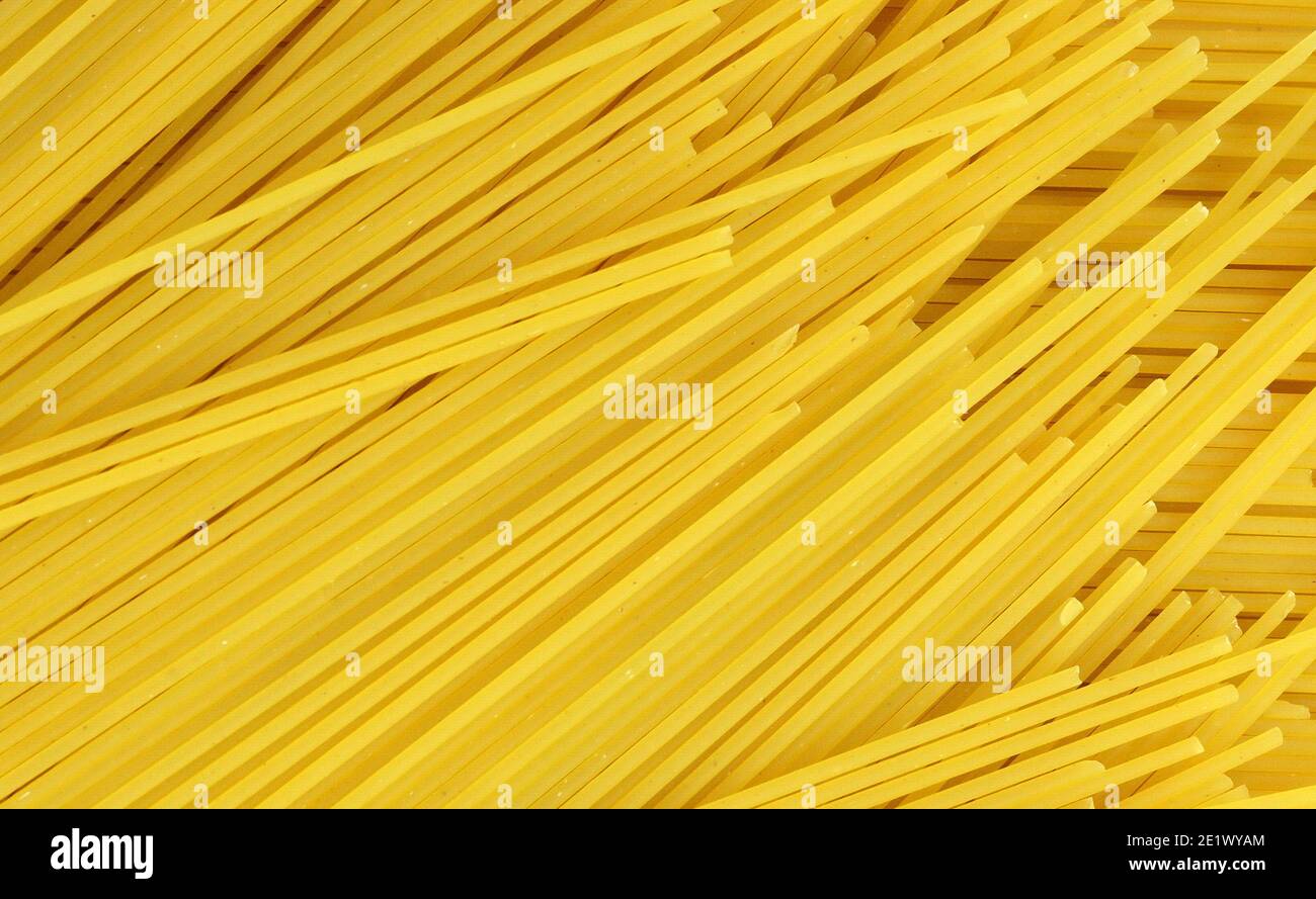 Spaghetti - yellow pasta, ready for cooking. isolated on the white ...