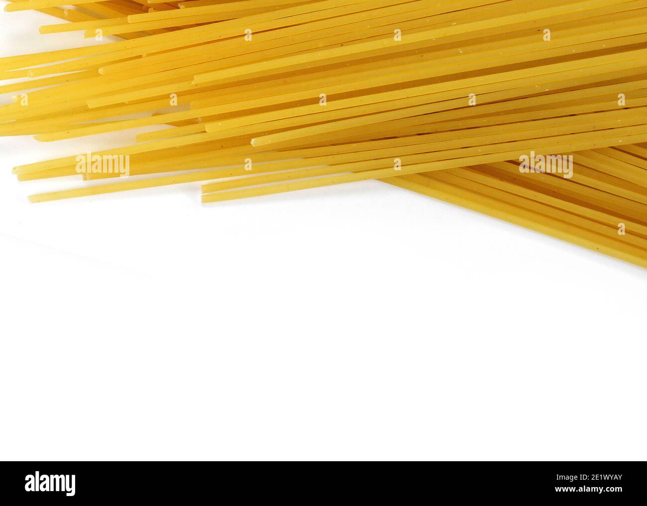 Spaghetti - yellow pasta, ready for cooking. isolated on the white ...