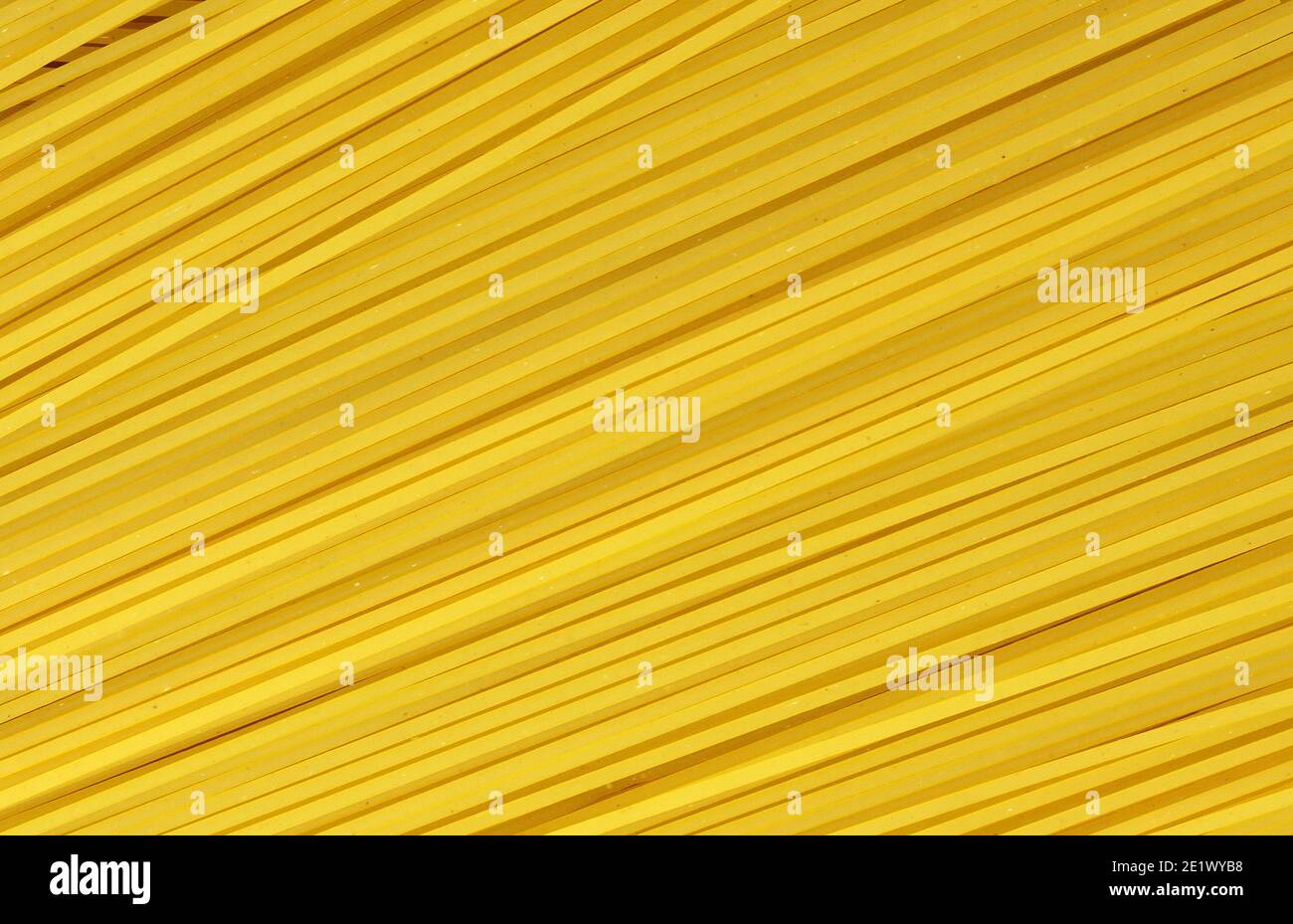 Spaghetti - yellow pasta, ready for cooking. isolated on the white ...