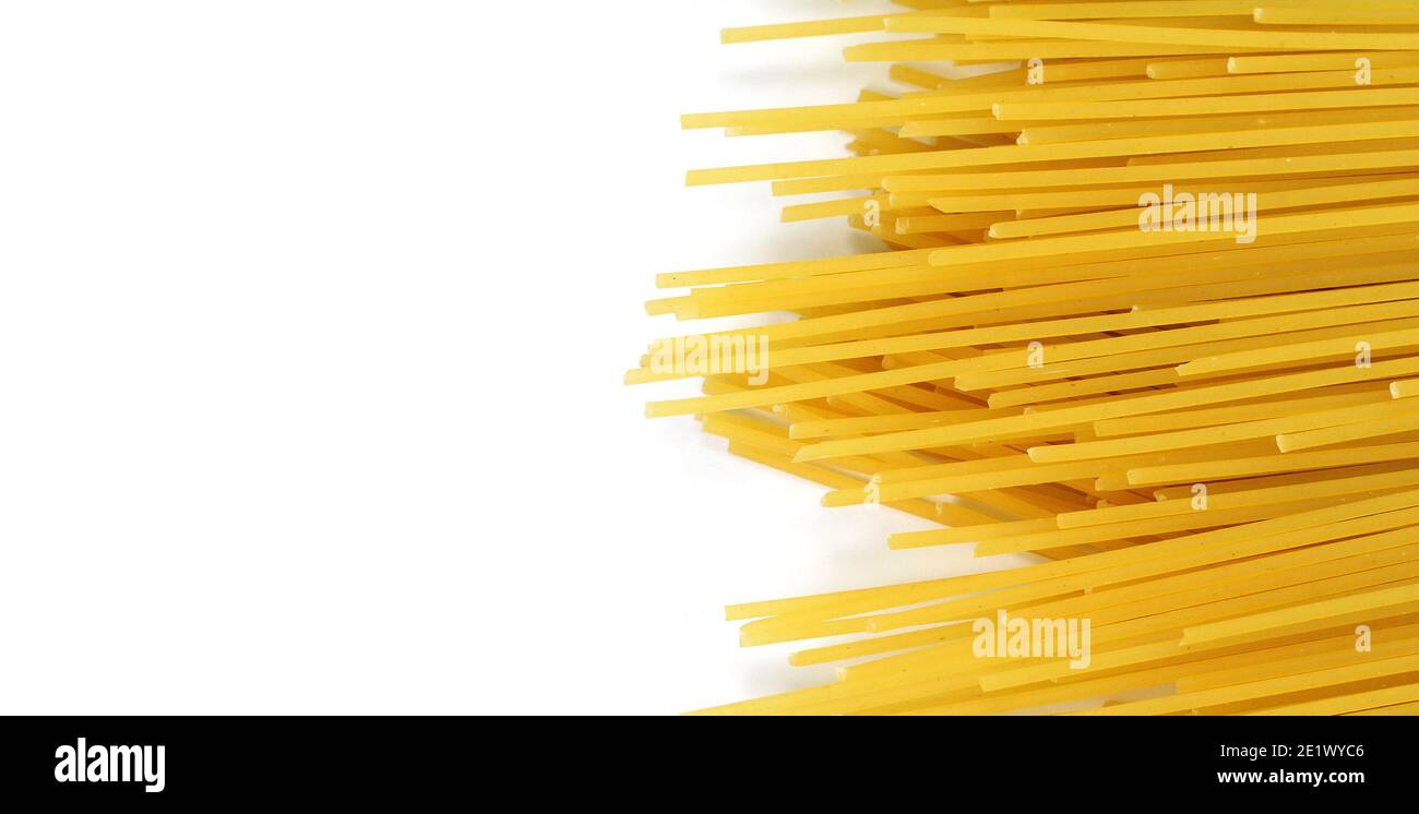 Spaghetti - yellow pasta, ready for cooking. isolated on the white background. uncooked ...