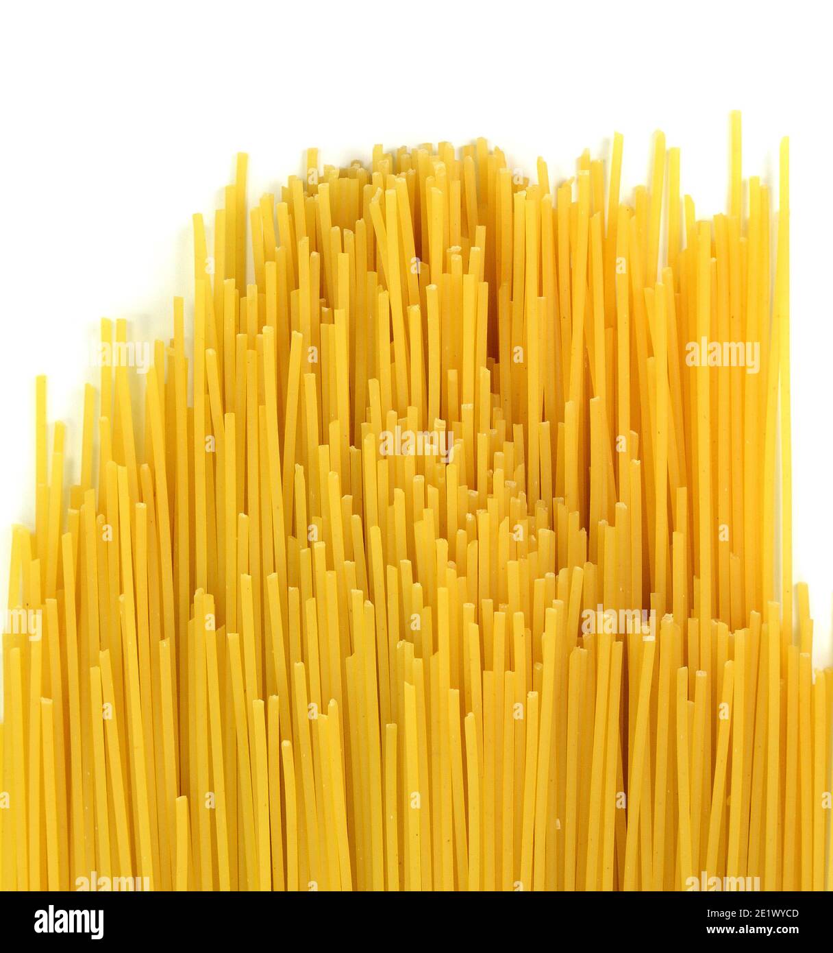 Spaghetti - yellow pasta, ready for cooking. isolated on the white ...