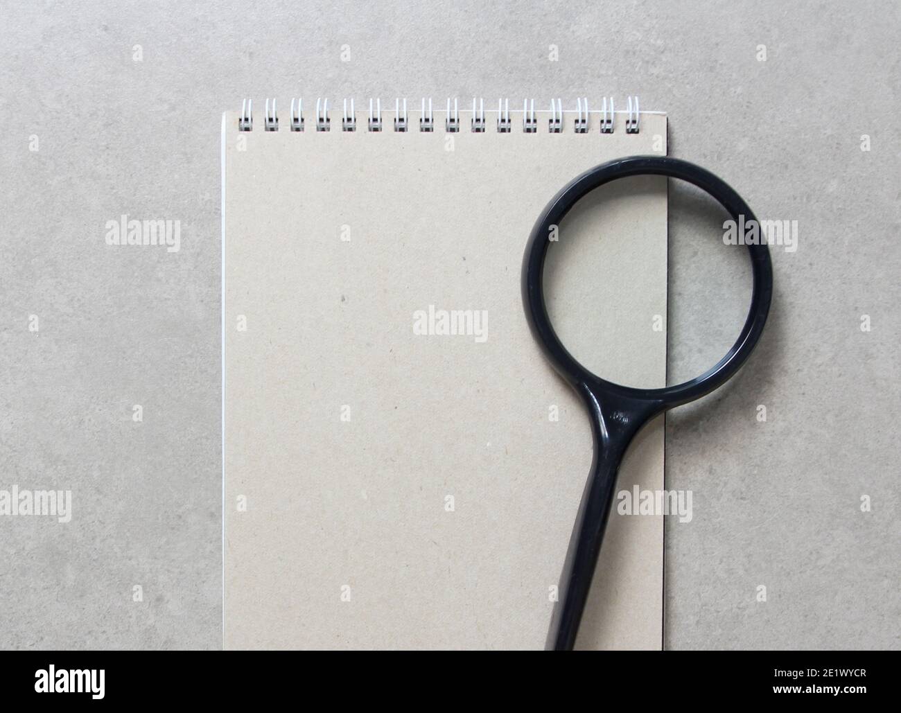 A spring notebook with a sheet of craft paper A5 with black magnifying ...