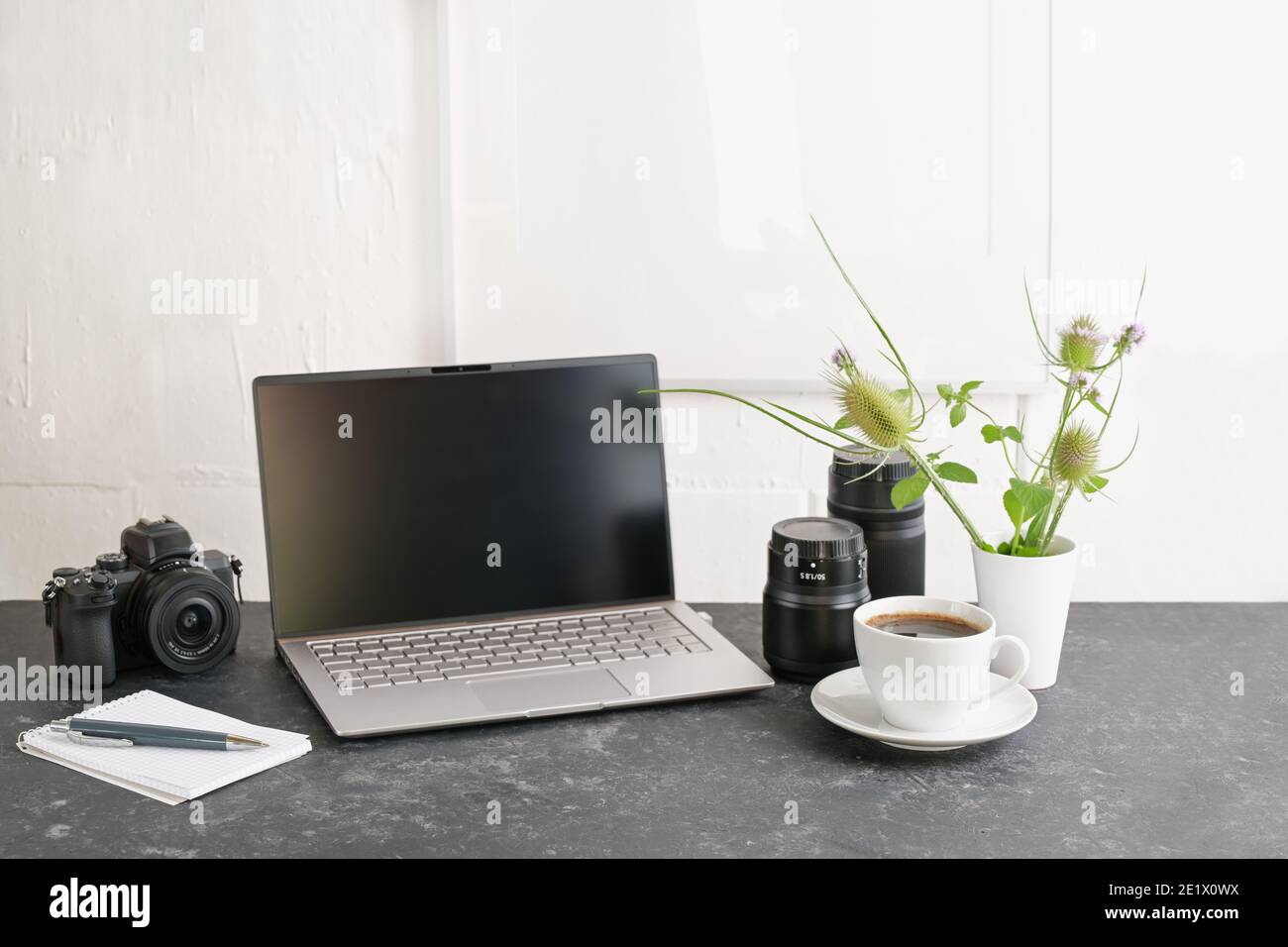 Office workspace of a photographer designer, gray desk with laptop ...