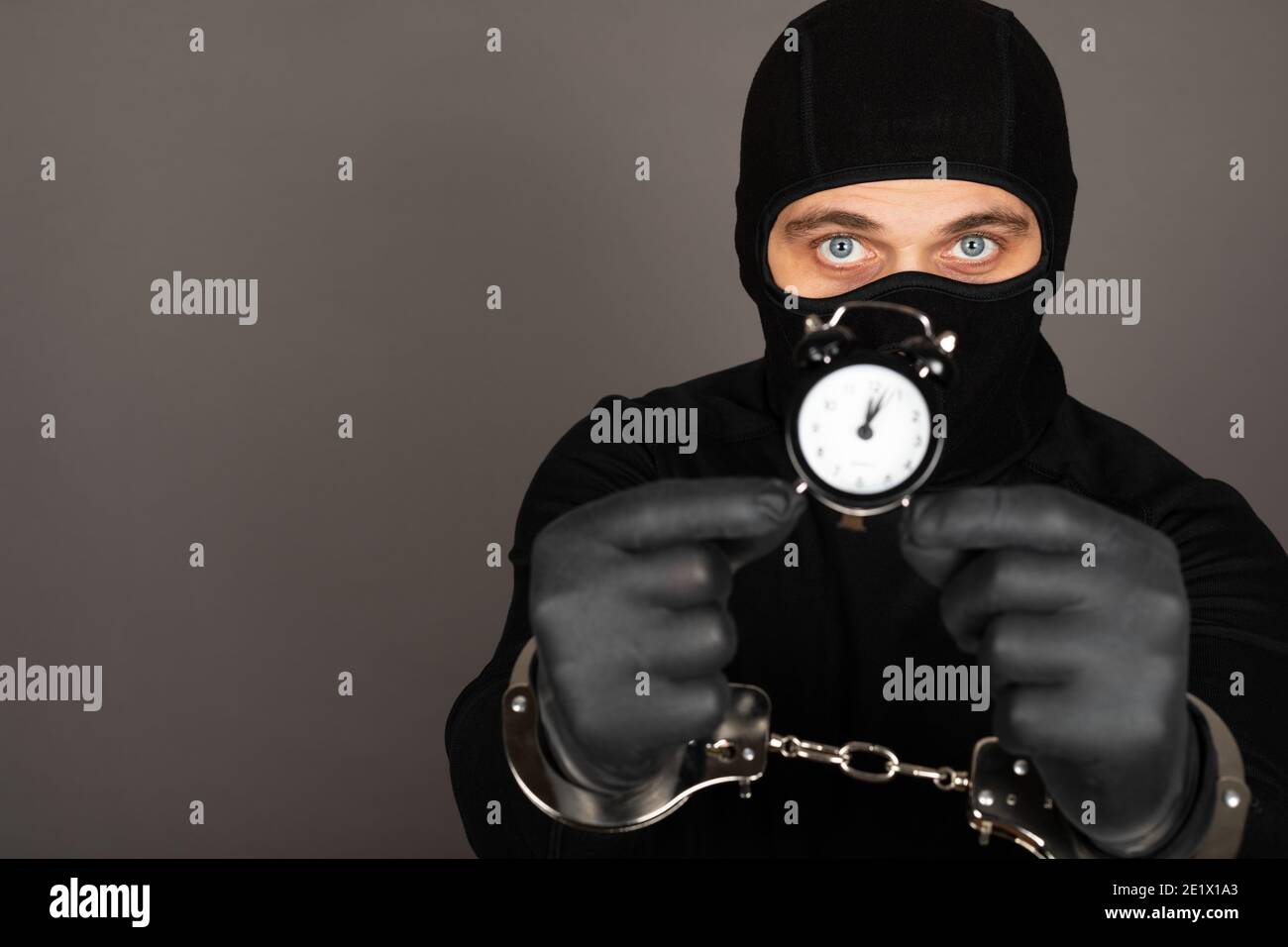 Picture of young man with black mask and outfit suspect of a robbery ...