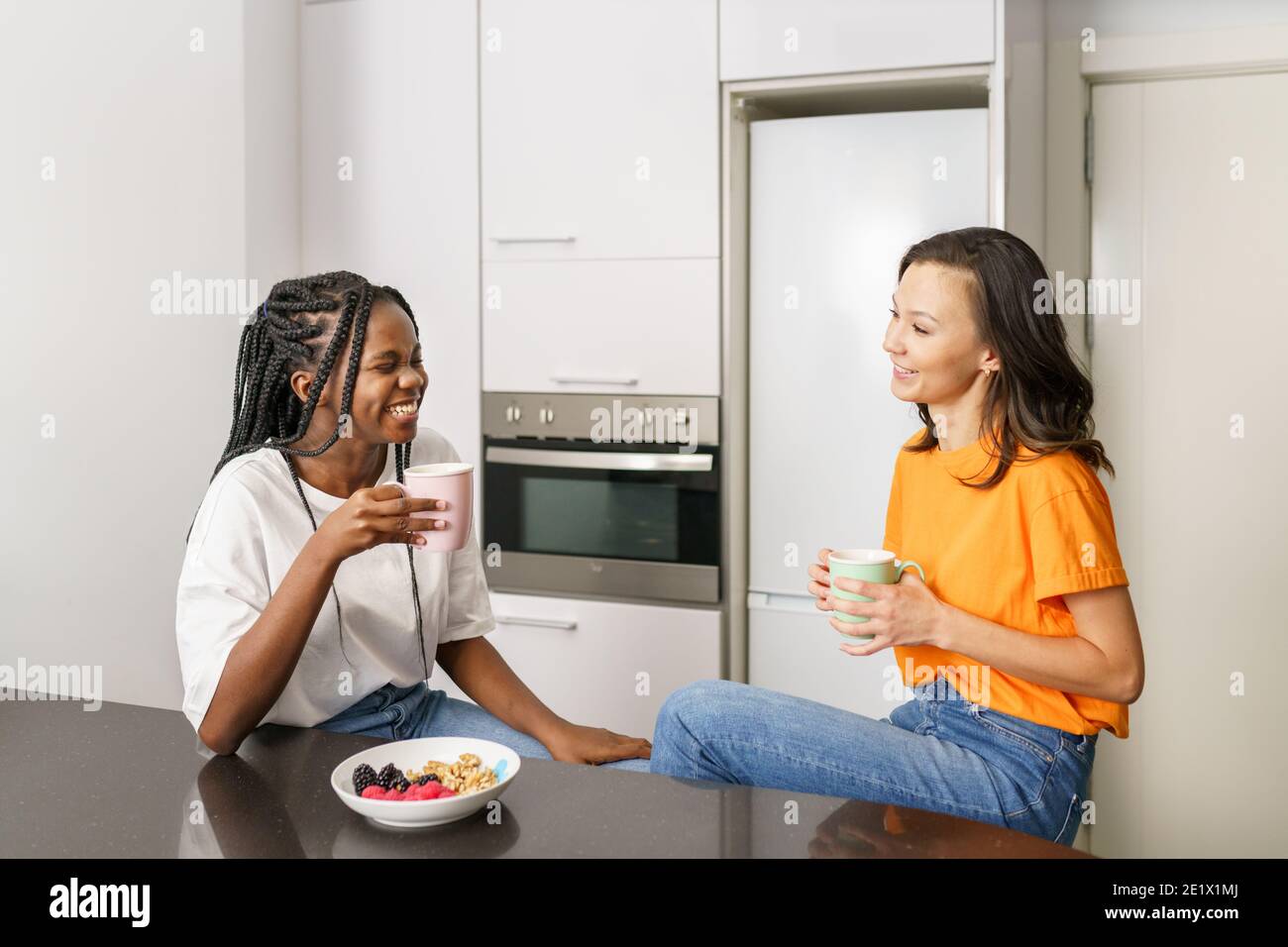 Two black friends having a conversation hi-res stock photography and ...
