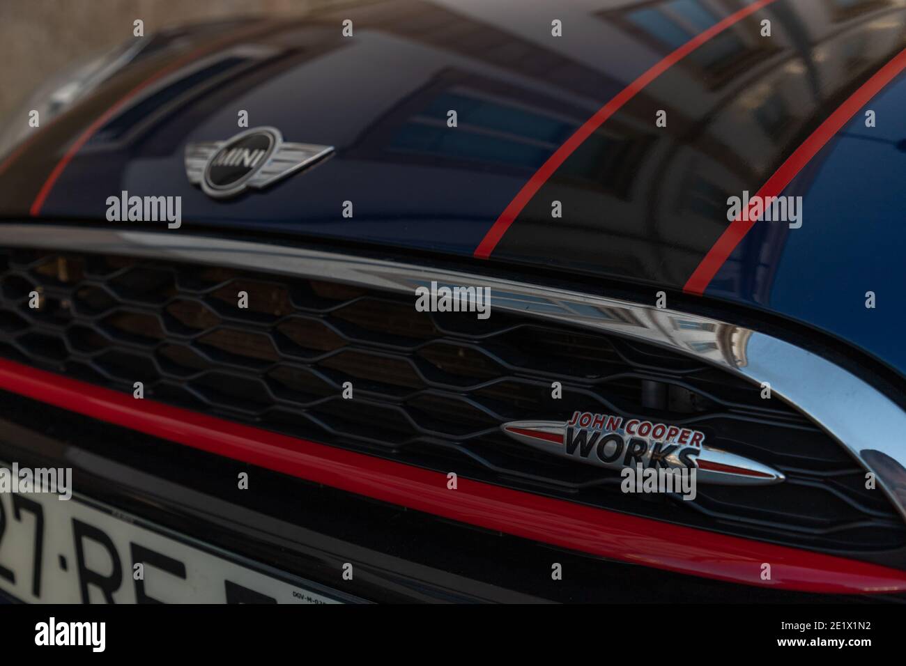 A close-up picture of the John Cooper Works and Mini logos on the hood ...