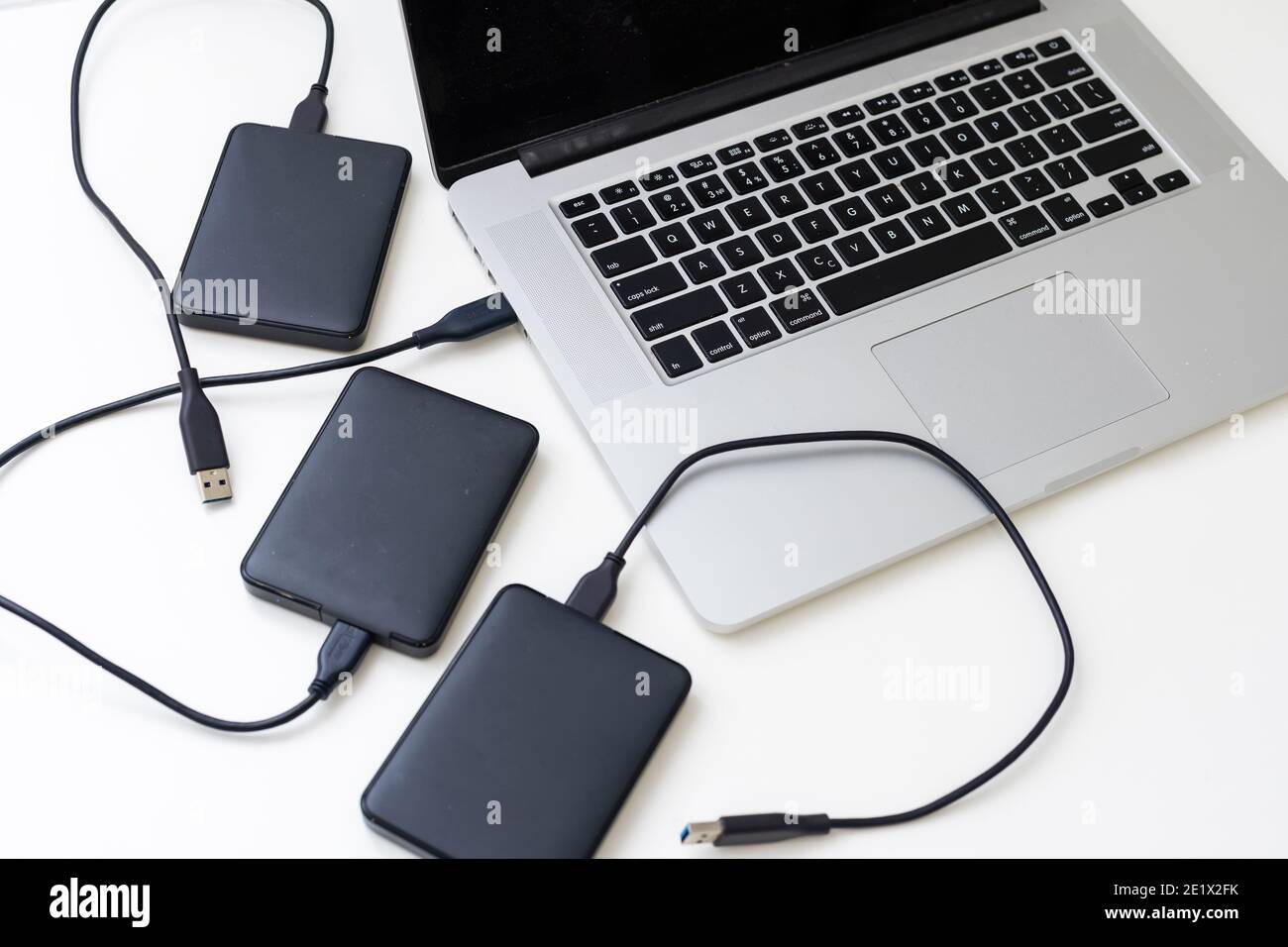 External backup disk hard drive connected to laptop Stock Photo - Alamy