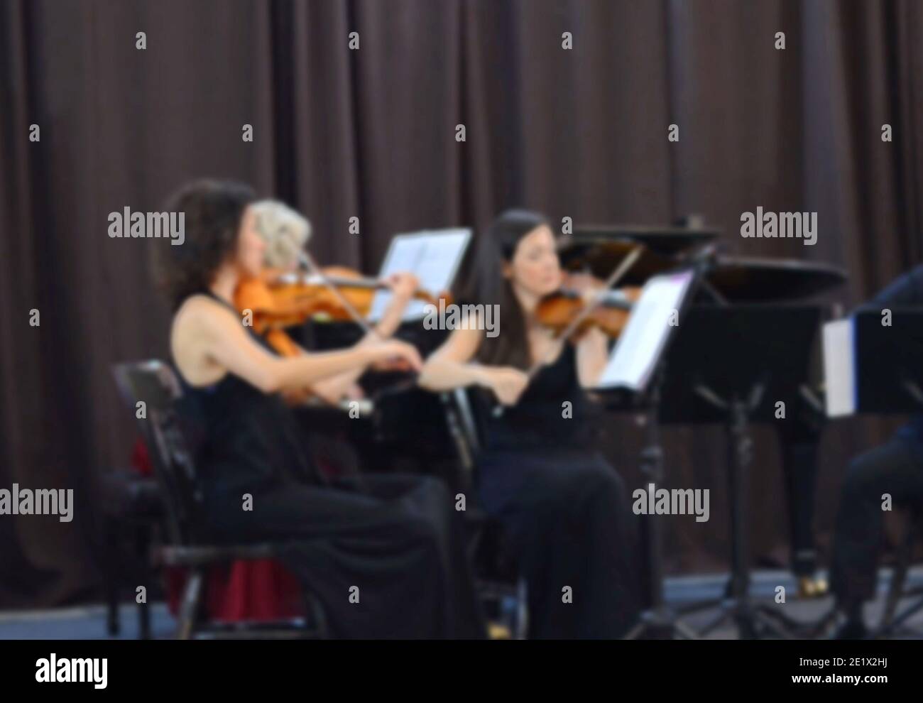 abstract blurred image. Actor violinist playing the violin strings ...