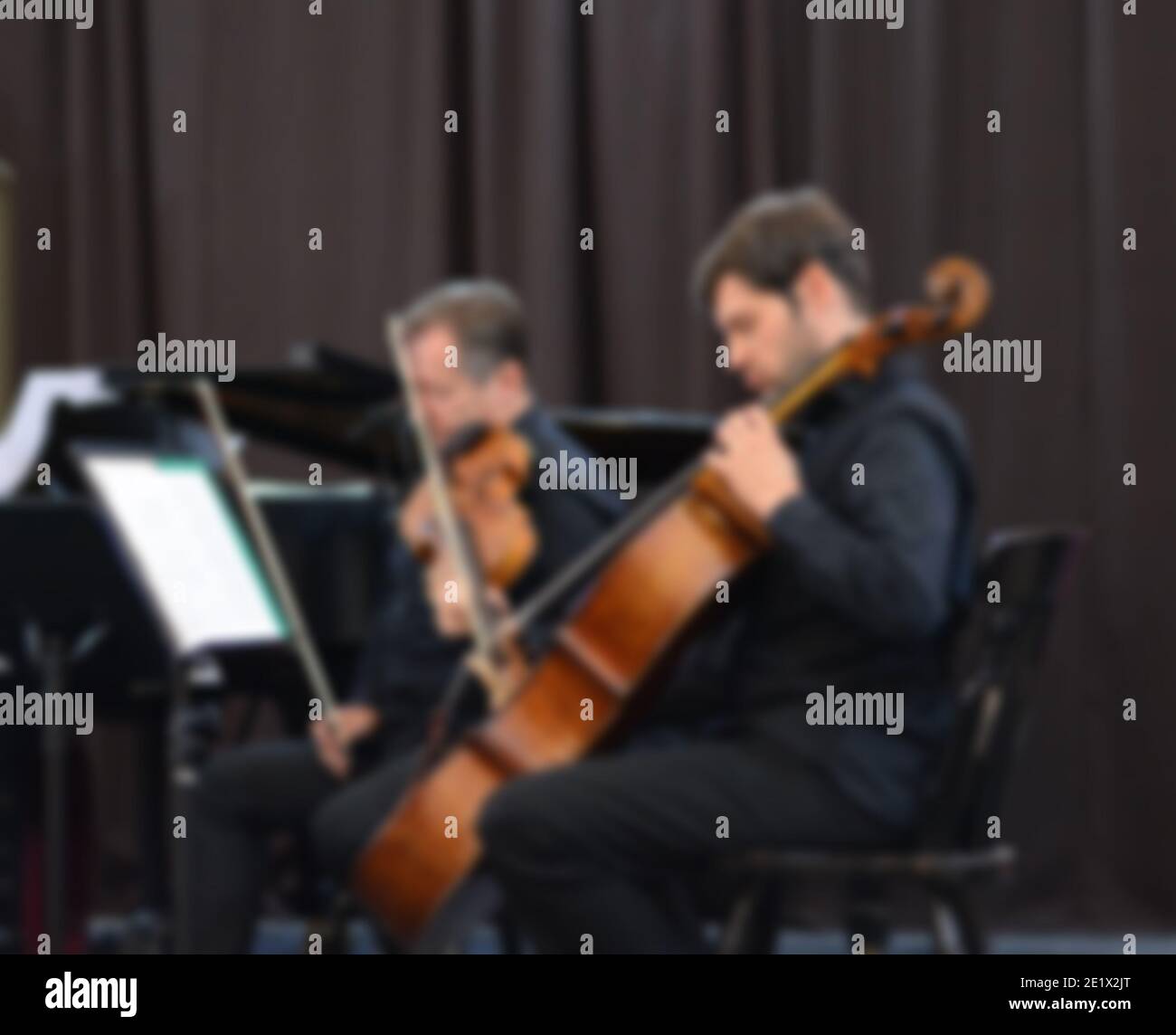 abstract blurred image. Actor violinist playing the violin strings ...
