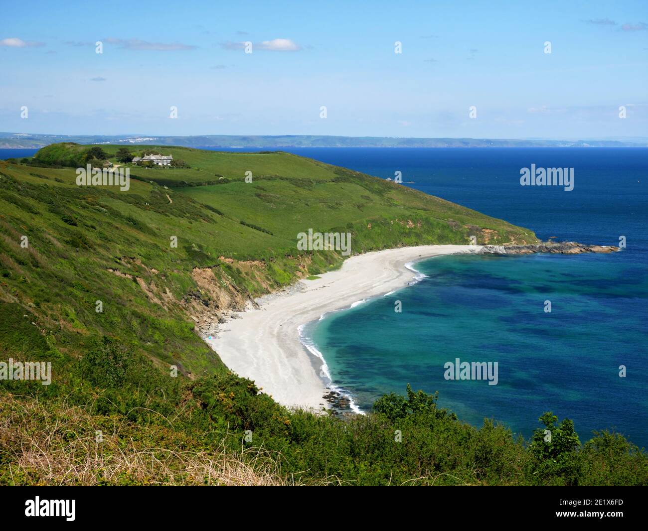 Vault Beach near Gorran Haven, Cornwall. Lamledra House in the distance ...