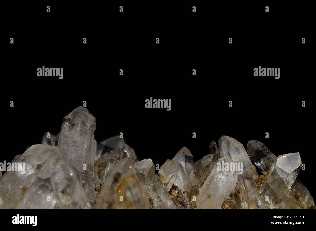 bright rock crystal with pointed and black background Stock Photo - Alamy