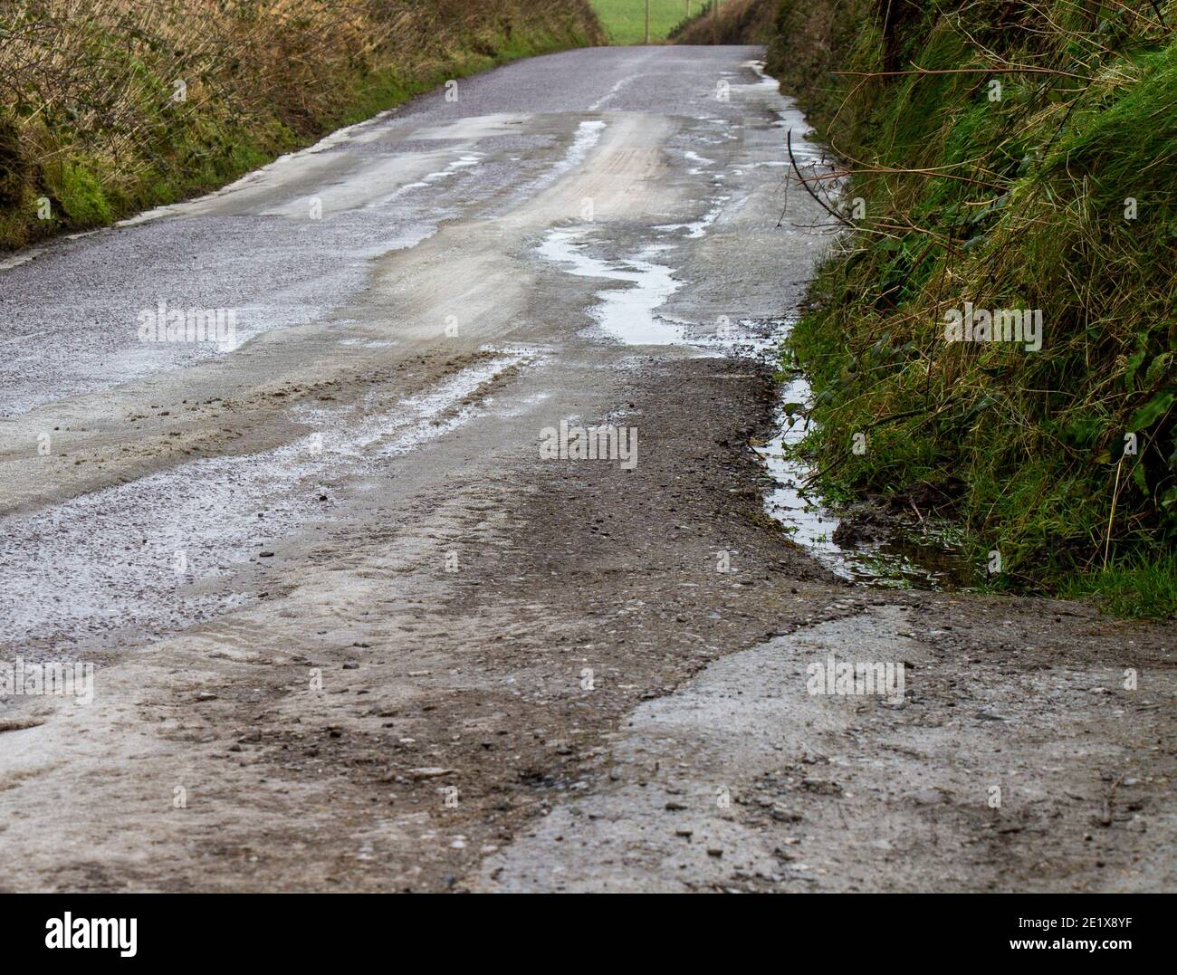 Frozen surface runoff on roads causing driving hazard Stock Photo - Alamy