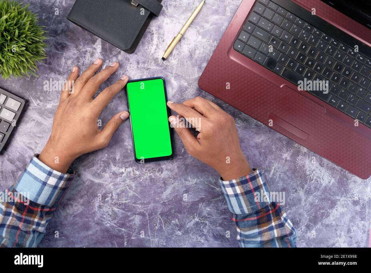 top view of man hand using smart phone on office desk Stock Photo - Alamy