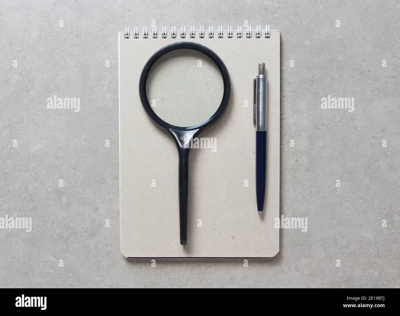 A spring notebook with a sheet of craft paper A5 with a ballpoint pen ...