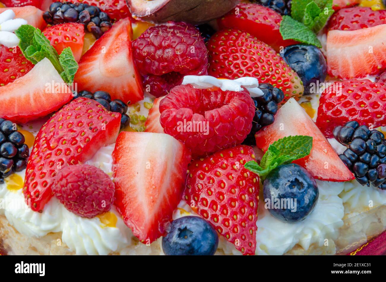 Anna Pavlova French dessert with blueberries, passion fruit ...