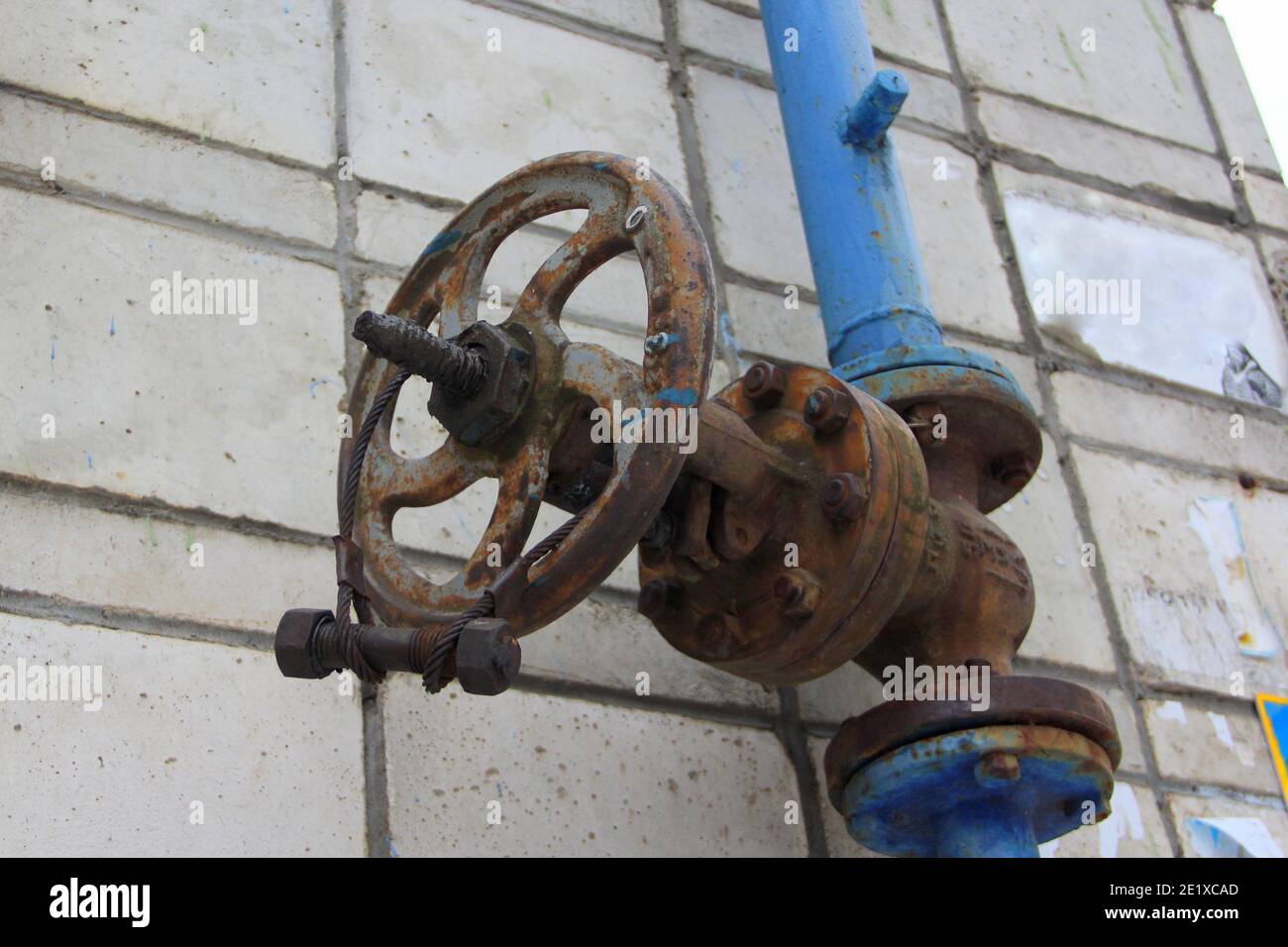 Old damaged and rusty iron oil pipe valve wheel. Metal, pipeline and ...