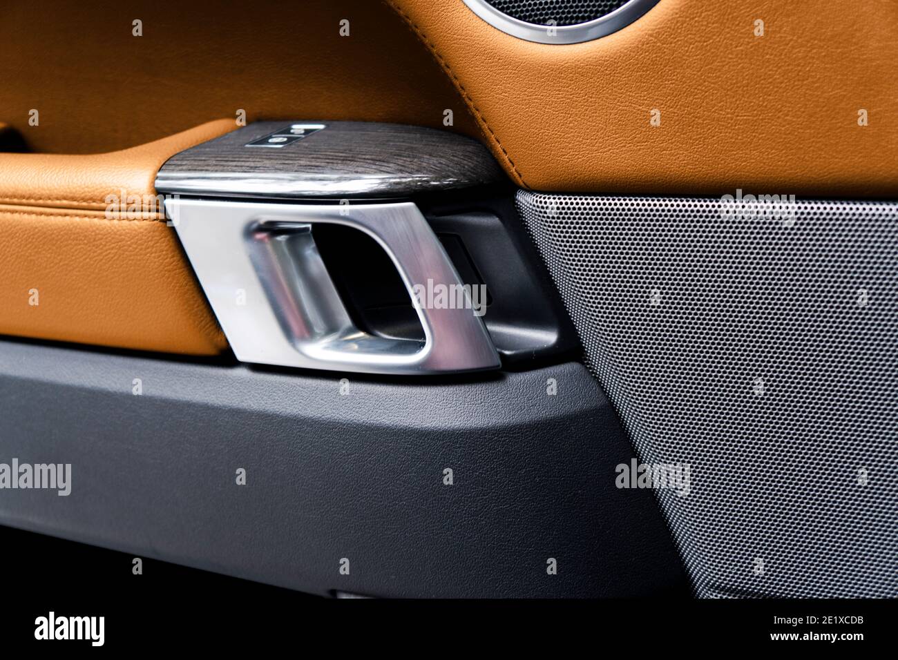 Car door handle inside the luxury modern car with brown leather texture ...