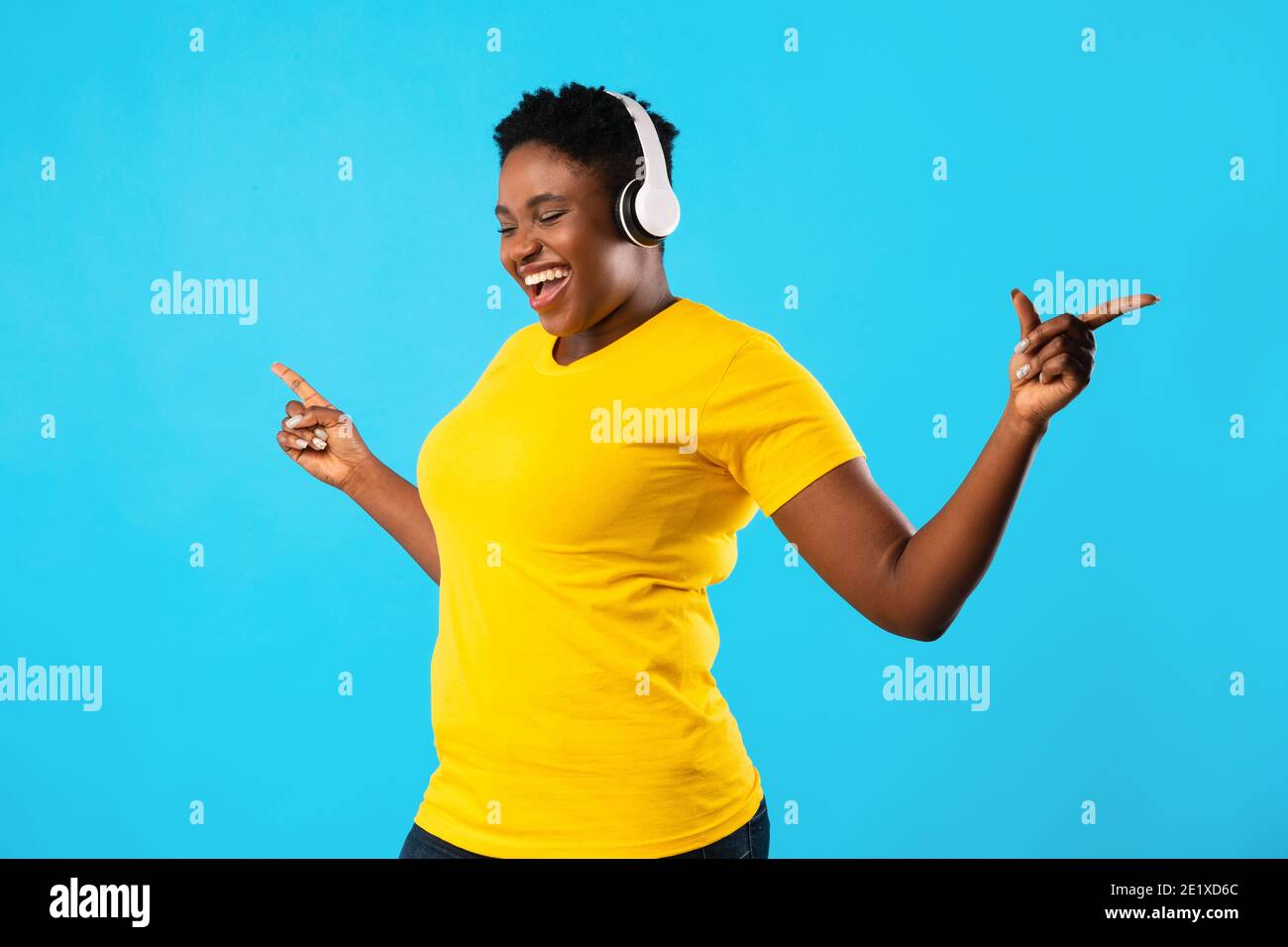 Black Overweight Lady Listening Music Dancing Over Blue Studio ...