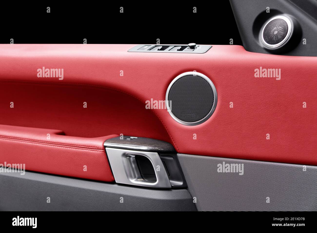 Car door handle inside the luxury modern car with red leather texture ...