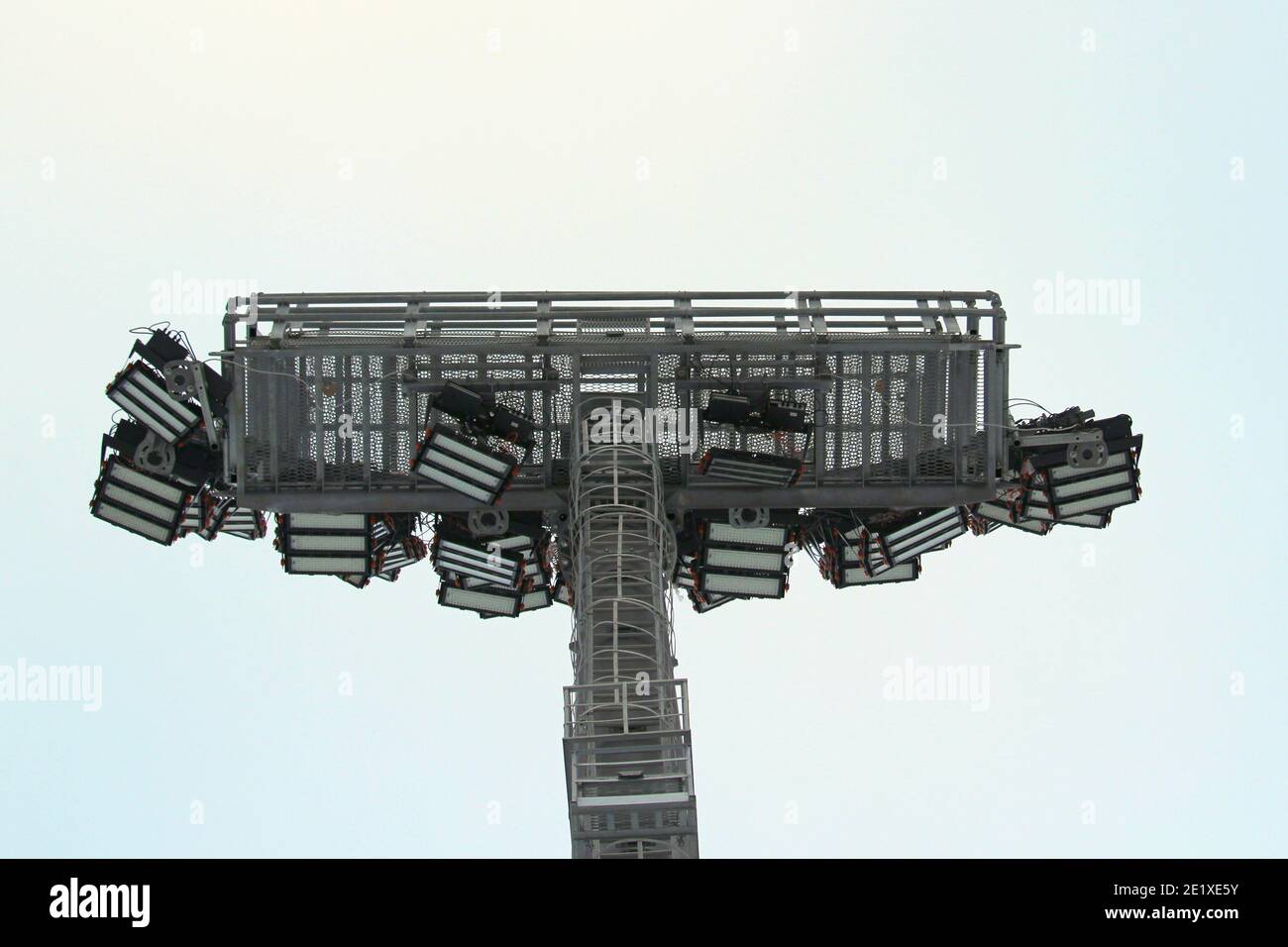 Spotlight on a sports stadium on blue sky background, daylight, close ...
