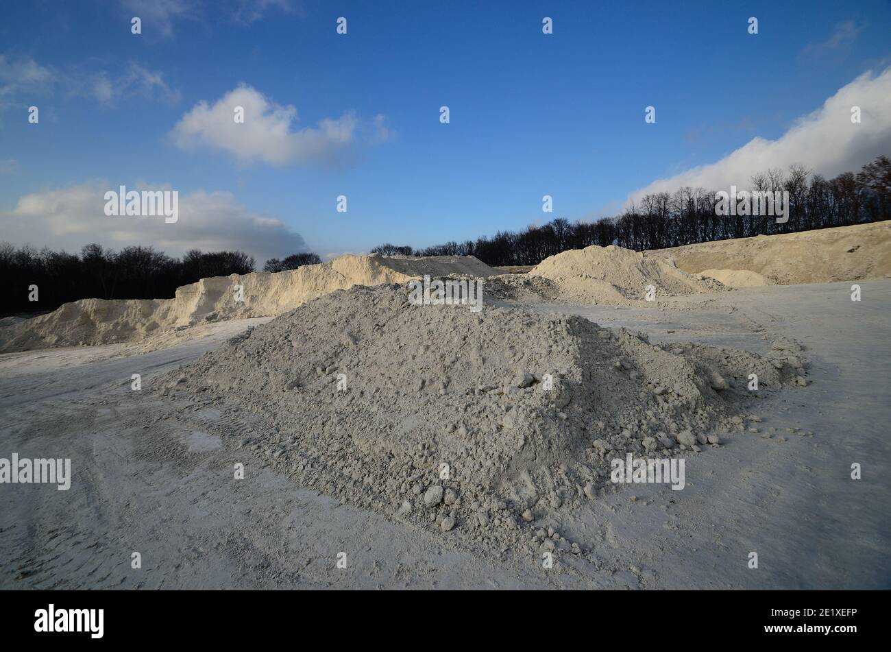 white limestone quarry in the forest with blue sky Stock Photo - Alamy