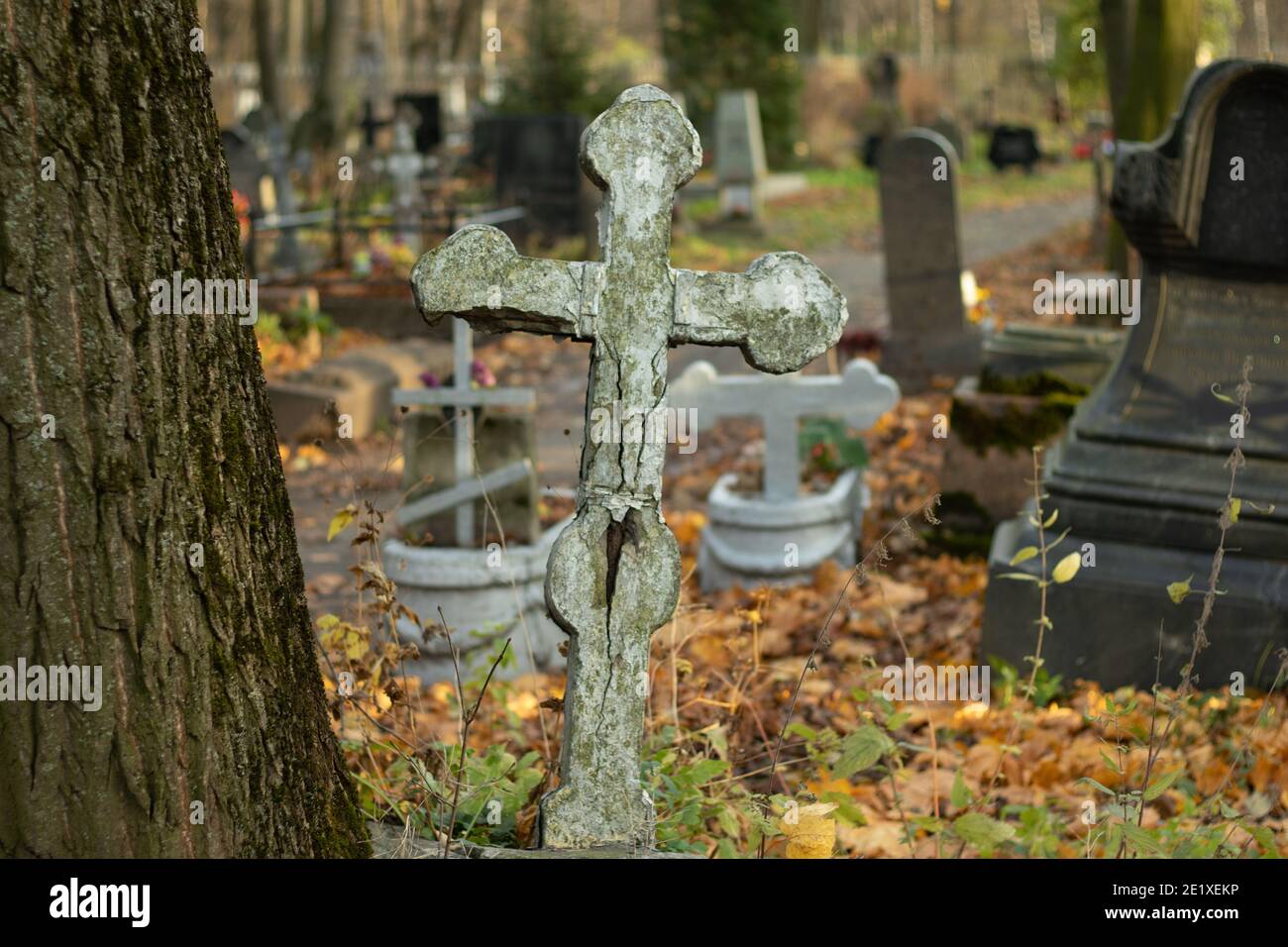 Cracked stone Christian cross in an Orthodox cemetery in autumn Stock ...