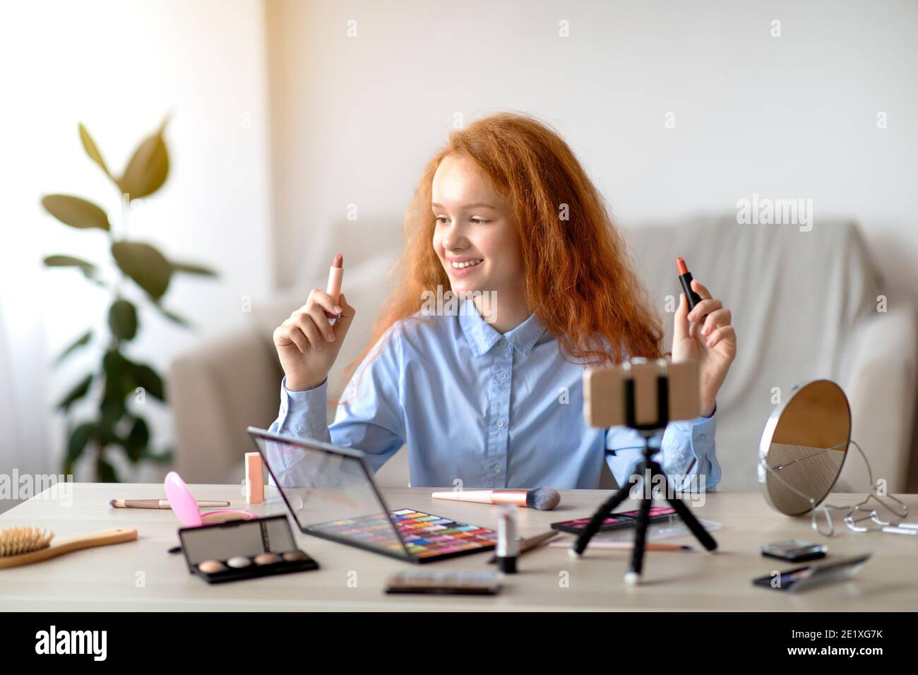 Red-Haired Teen Girl Recording Her Beauty Blog, Choosing Lipstick Stock ...