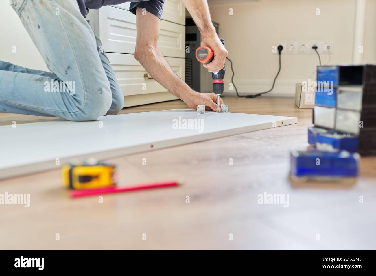 Close up detail of furniture and hands of carpenter worker with ...