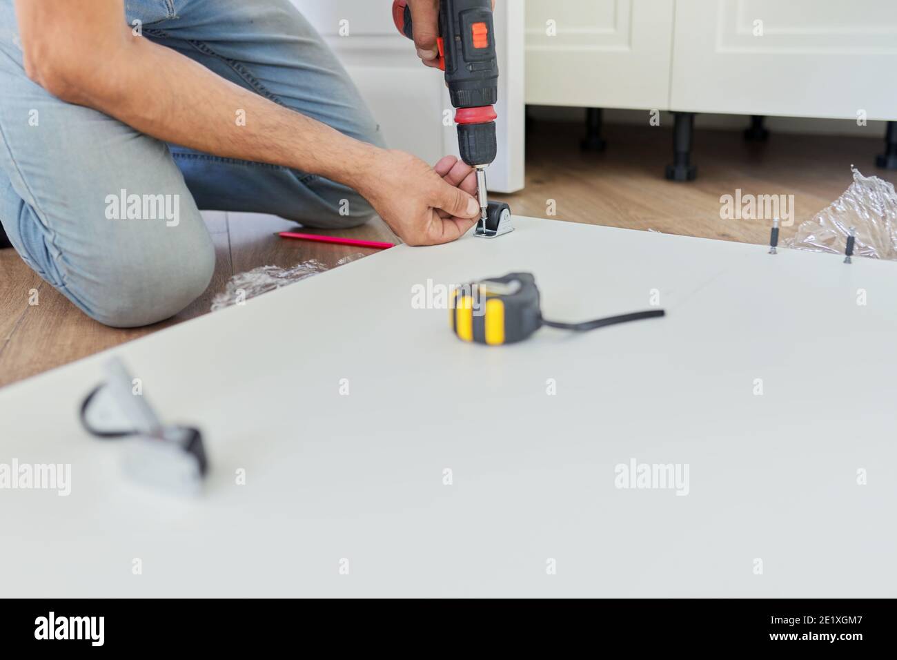 Close up detail of furniture and hands of carpenter worker with ...