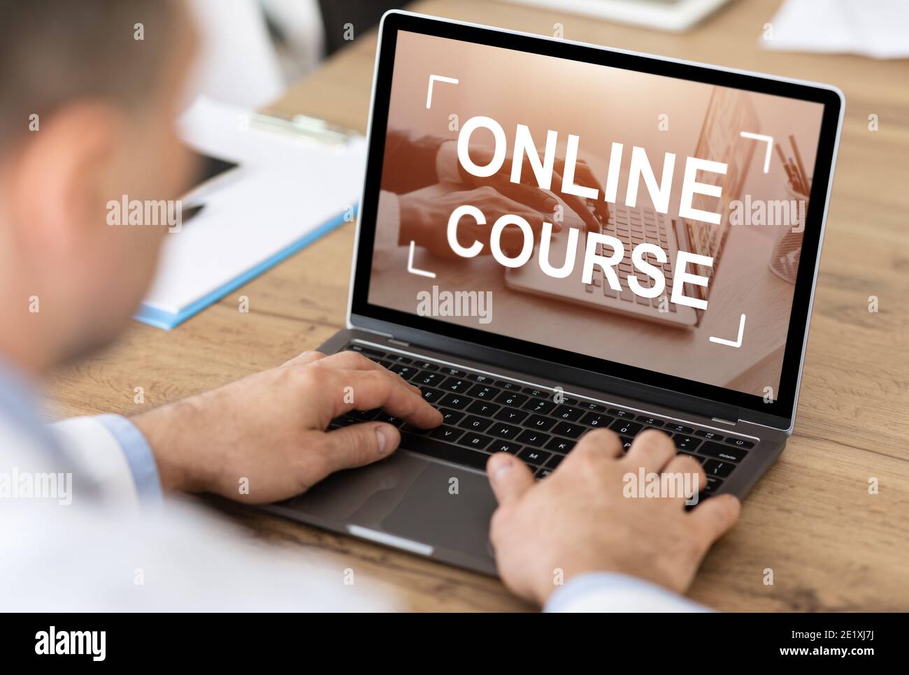 Caucasian businessman having online course, office interior Stock Photo ...