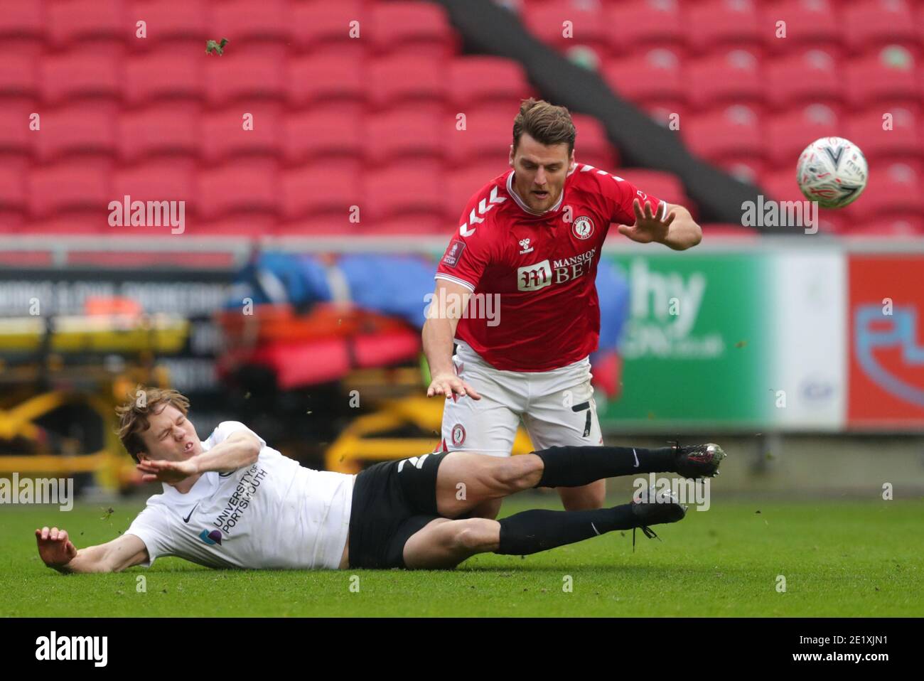 Portsmouth's Sean Raggett challenges Bristol City's Chris Martin during ...