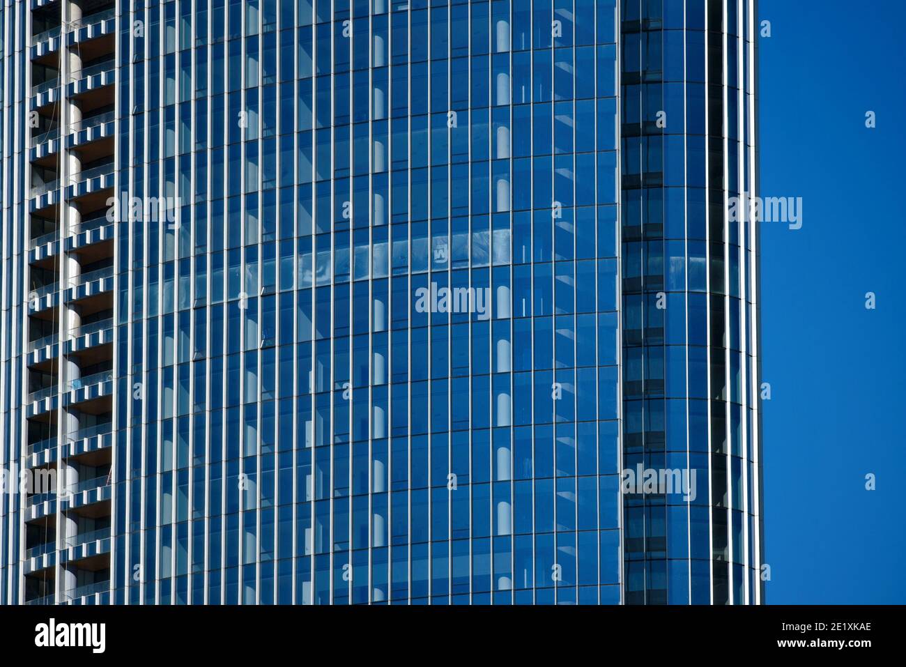 Modern design high-rise corporate building facade with blue glass ...