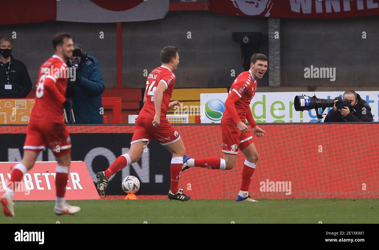 Crawley Town's Jordan Tunnicliffe (right) celebrates scoring his side's ...