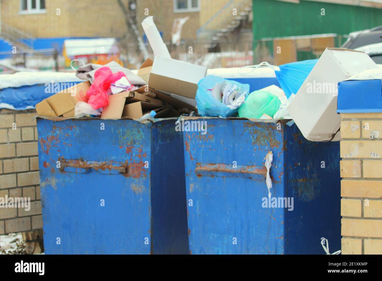 Old rusty street garbage containers of blue colors. Waste recycling ...