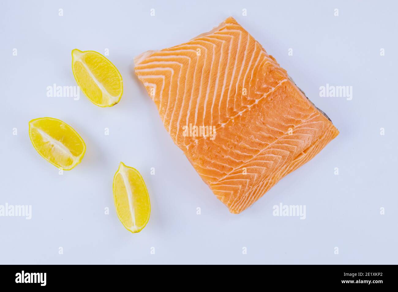 Fresh salmon fillet with lemon on the isolated on white background ...
