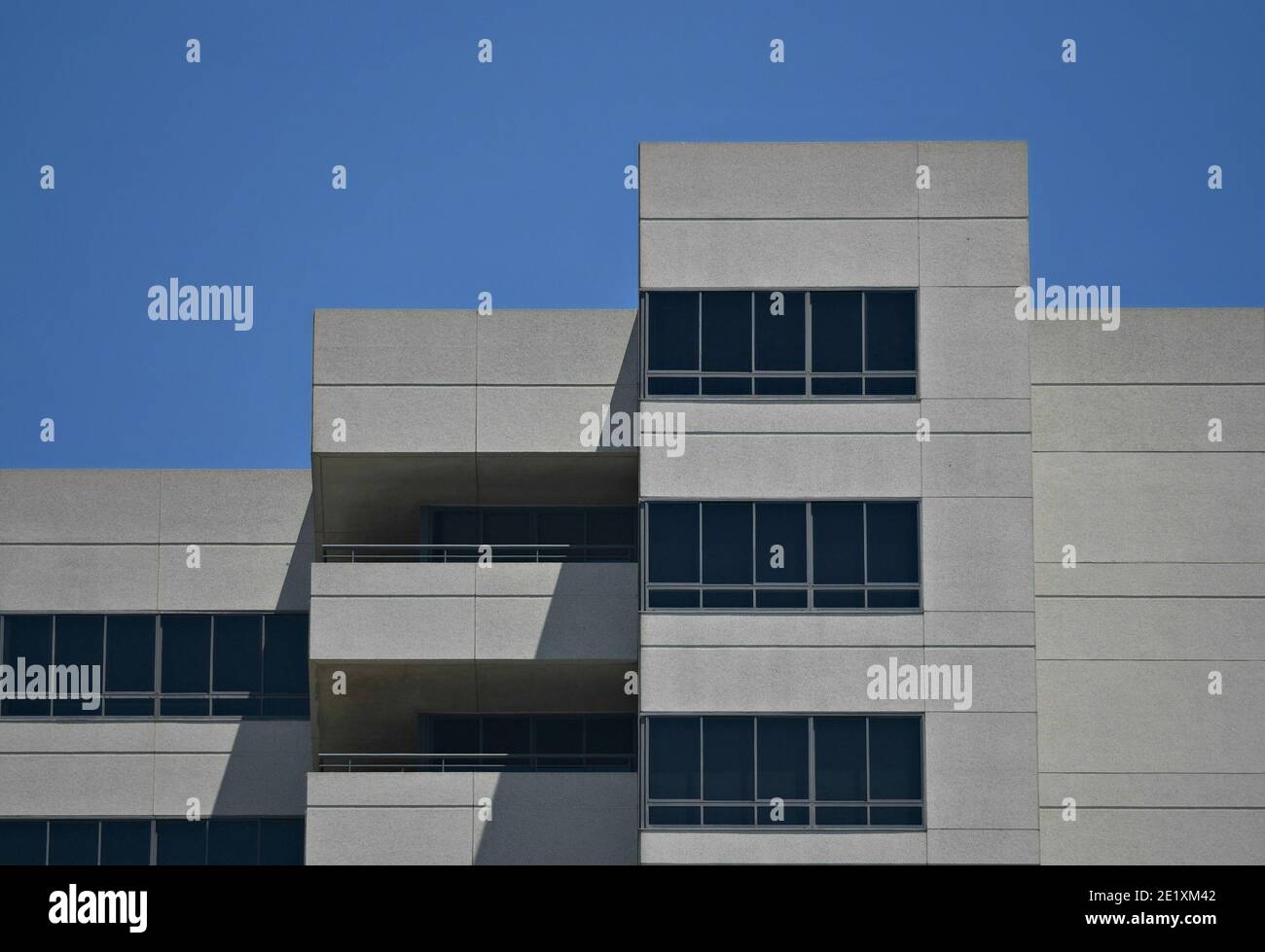 Modern design high-rise commercial building with an exposed concrete ...