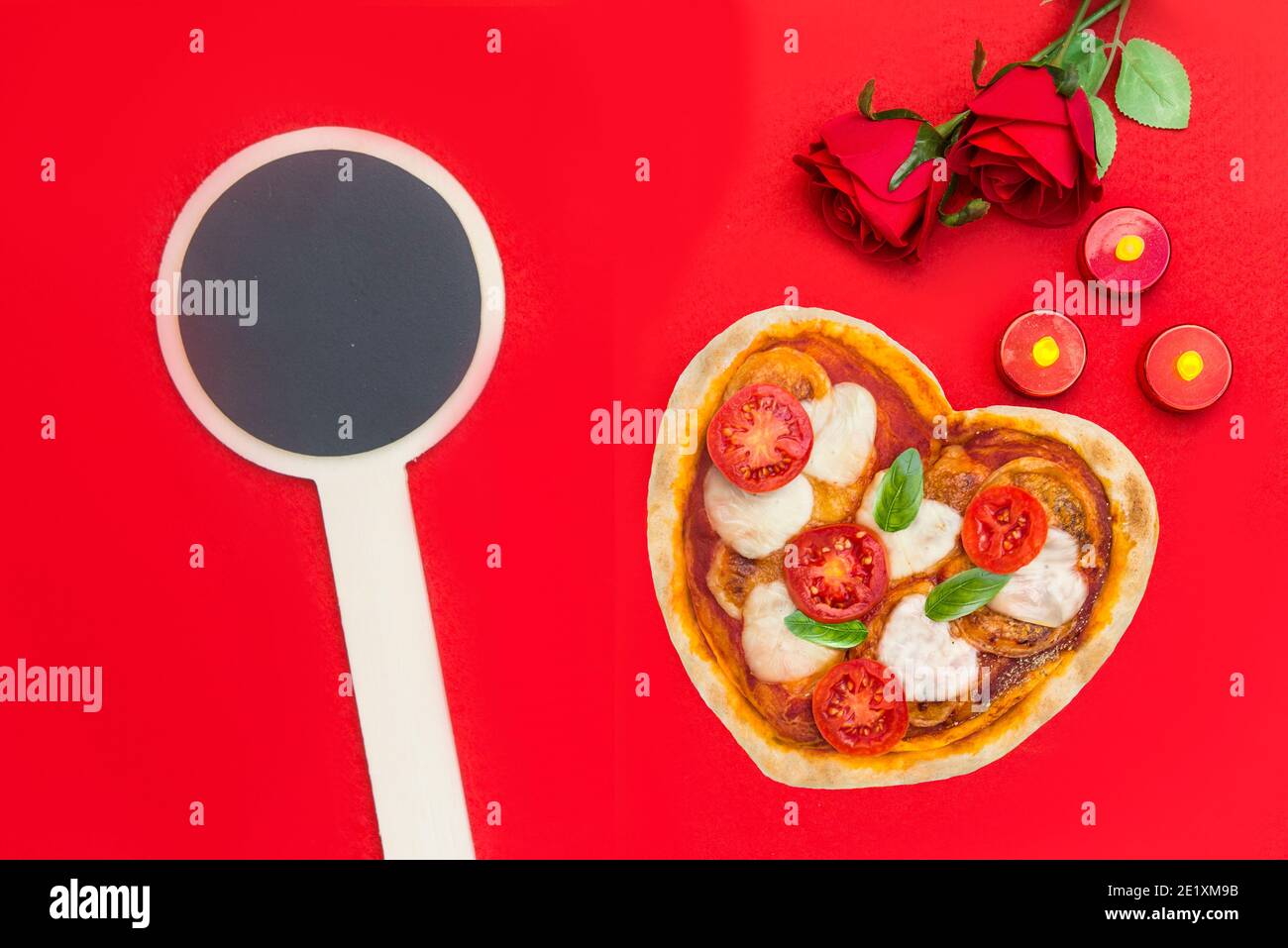 heart-shaped pizza for a special evening Stock Photo - Alamy
