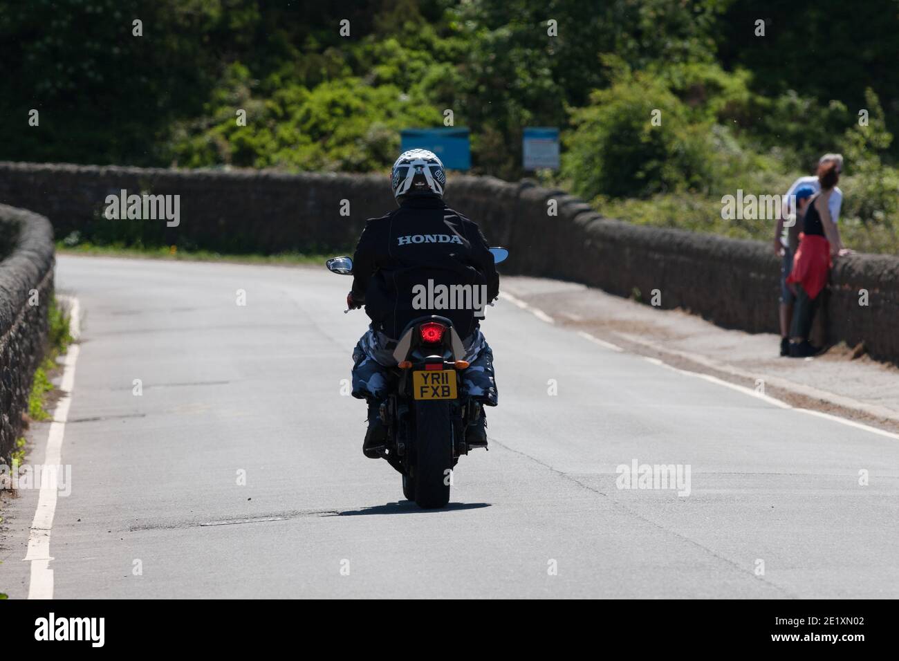 Peak District, UK - May 25 2020: A biker at Langsett Reservoir in the ...